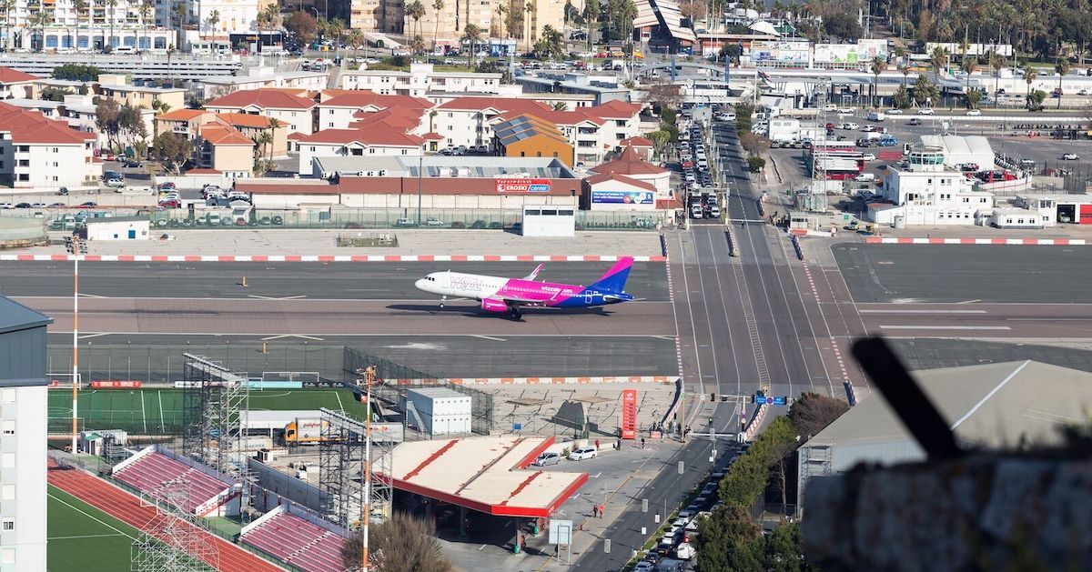 The Gibraltar Airport’s Runway Intersects With City Traffic