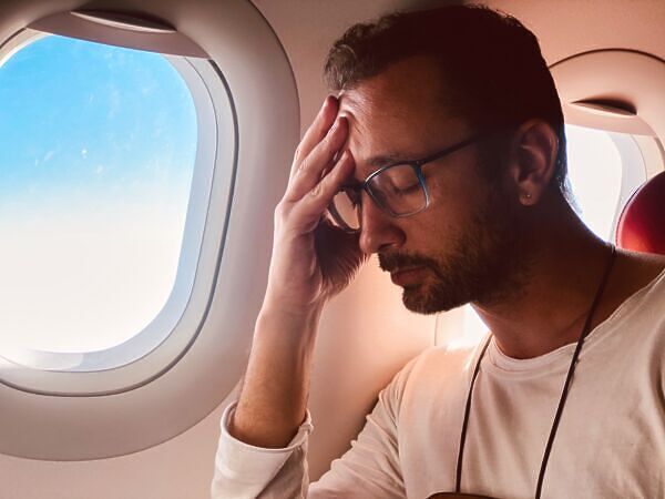 Why Do I Always Feel Sick and Have a Sore Throat After Flying?