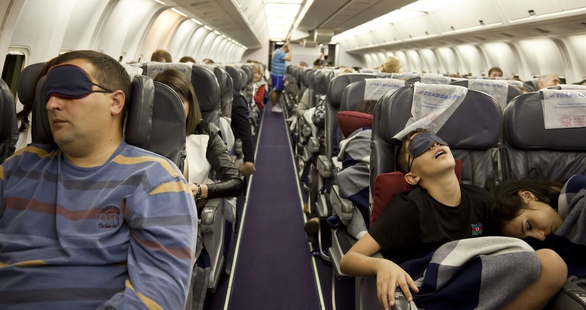This Is the Cheapest and Simplest Hack to Sleep on Planes
